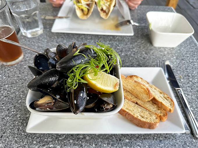 These mussels aren't just steamed &ndash; they're pampered in white wine and garlic, served with grilled bread for sauce-soaking duty.