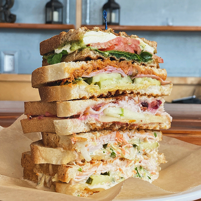 A sandwich stacked higher than a Maine lighthouse, proving that sometimes more really is more - especially between bread.