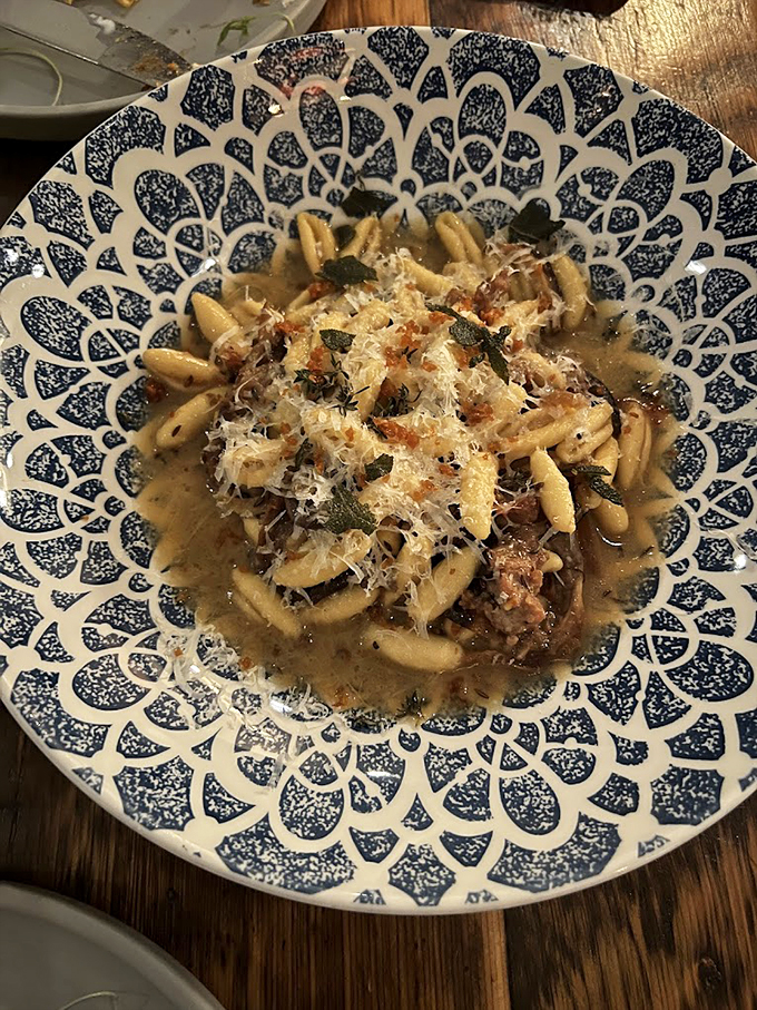 House-made pasta swimming in a savory sauce, crowned with fresh herbs and parmesan - comfort food gets dressed up.