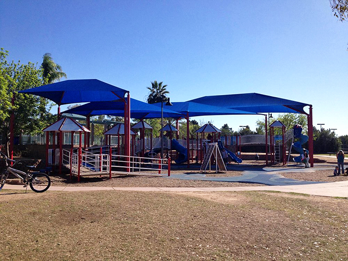 Welcome to the land of "Just five more minutes, please!" This colorful playground is kryptonite to any parent trying to leave the park. Photo credit: Julie3679