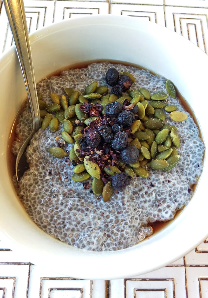 This isn't your grandmother's porridge - topped with pumpkin seeds and berries, it's a breakfast that Instagram dreams are made of.