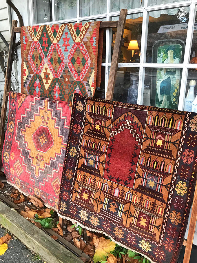 Hand-woven rugs showcase intricate patterns and rich colors, each one a masterpiece of textile artistry from another era.