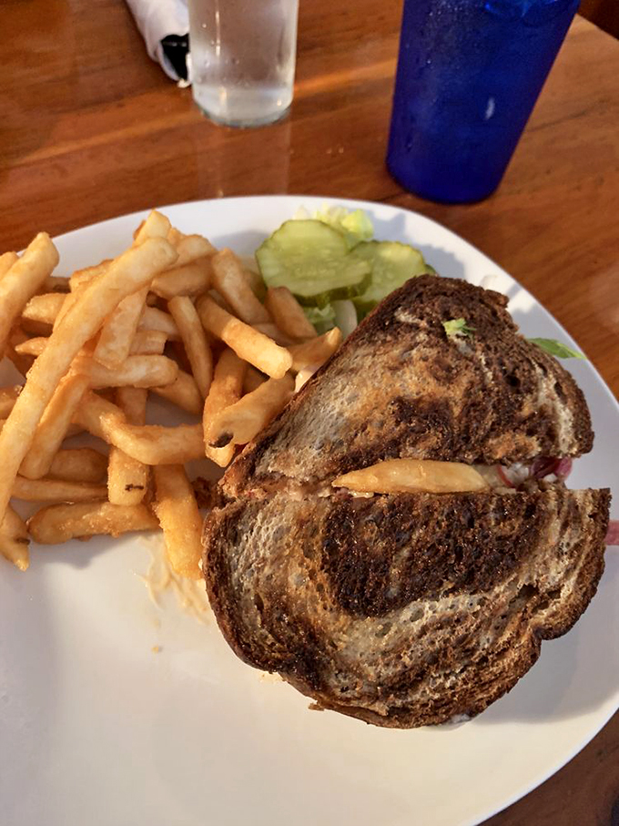 This Reuben isn't just a sandwich &ndash; it's an architectural marvel of marbled rye, melted cheese, and memories.