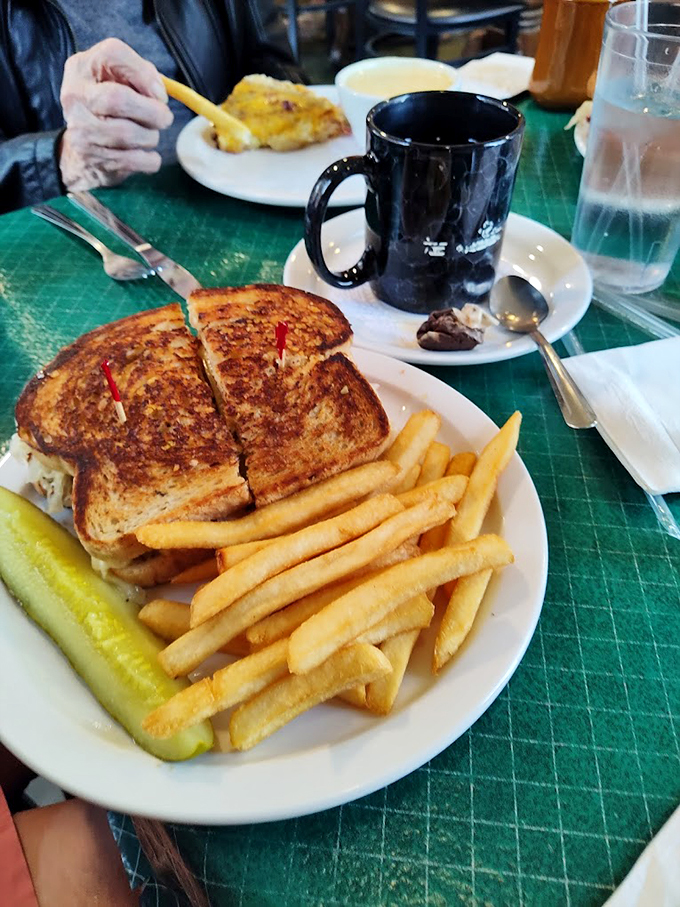 A perfectly grilled sandwich with crispy fries - the kind of lunch that makes you forget all about your diet.