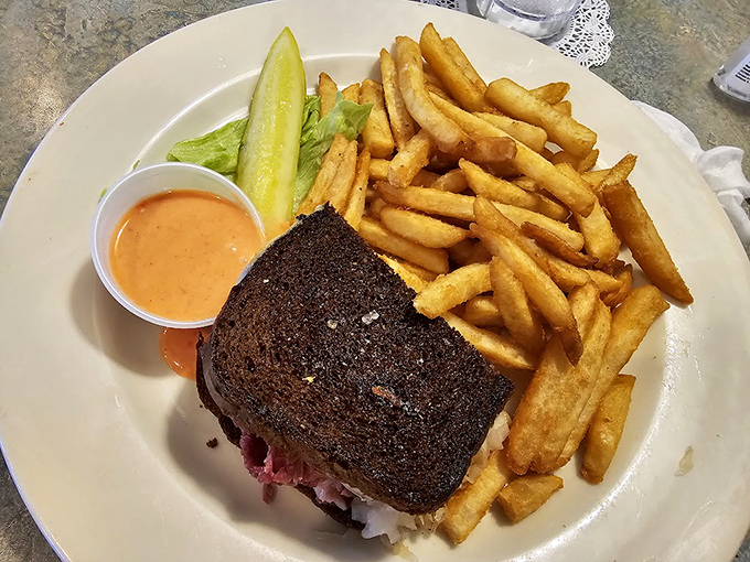 This blackened sandwich with golden fries isn't just lunch &ndash; it's comfort food engineering at its finest.