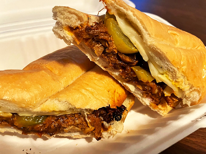 This Cuban sandwich isn't just lunch - it's a masterpiece of layered flavors, with pickles playing peek-a-boo between tender meat.