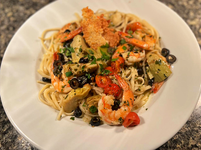 Shrimp, artichokes, and olives dance through linguine in a Mediterranean symphony. Who needs Italy when you've got this?