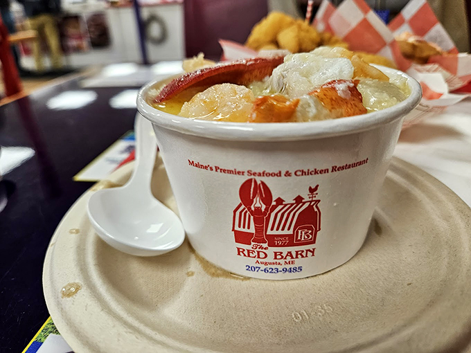 Steam rises from this hearty seafood stew, packed with chunks of lobster and fish in a rich, creamy broth.