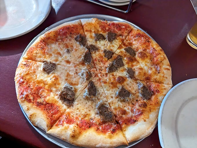 Holy mozzarella, Batman! This Sicilian pizza is so thick and cheesy, it could double as a life raft in a pasta emergency.