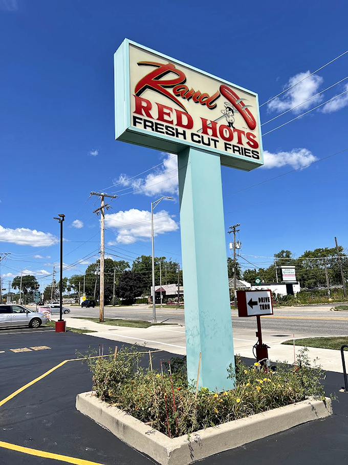 Against the blue Illinois sky, this retro sign has been guiding hungry souls to hot dog heaven for generations.
