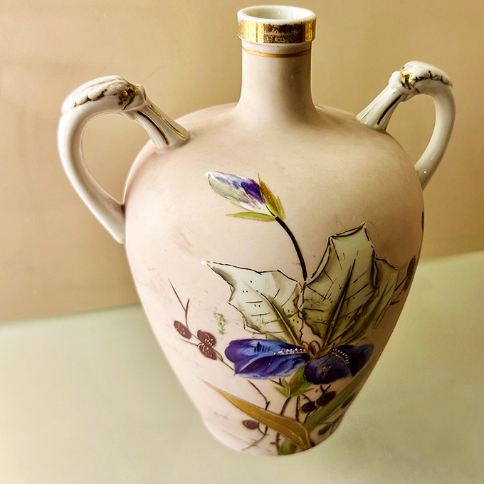 Lace meets pottery in this delicate dance of clay! This vase is so intricate, it could double as the world's fanciest pineapple.