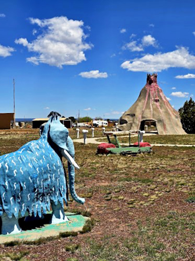 A blue mammoth stands sentinel against the Arizona sky, watching over this delightfully prehistoric playground.