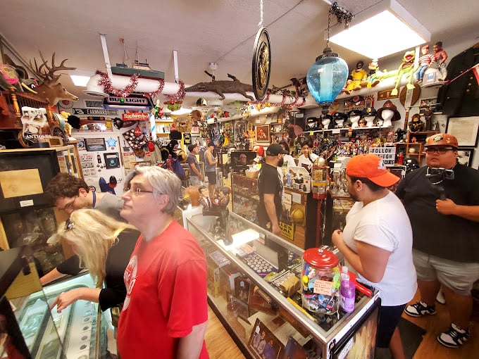 Treasure hunters browse display cases filled with collectibles, each item waiting to spark someone's nostalgic joy.