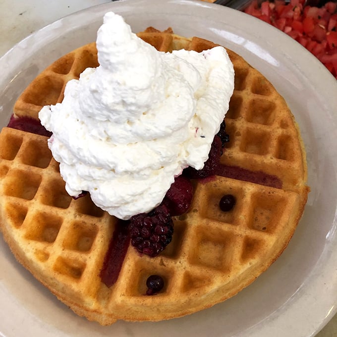 Waffles so good, they'll make you want to waffle on your diet. Crispy, fluffy, and topped with enough whipped cream to make a cloud jealous.