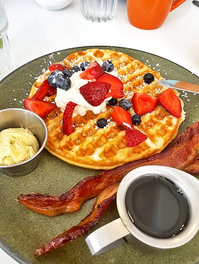 Fresh berries and cream transform this Belgian waffle into the kind of breakfast that makes you set your alarm early.