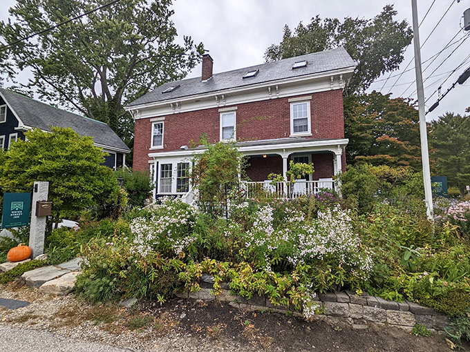 A classic New England brick beauty surrounded by a garden that would make Martha Stewart swoon.