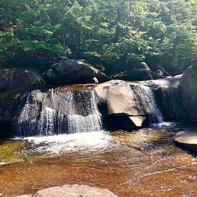 Like a liquid staircase, the falls step down through layers of granite sculpted by time itself.