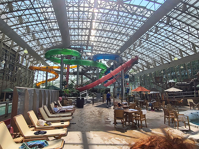 Comfortable seating areas surround the pools, perfect for parents who prefer to be lifeguards of their own little merpeople.