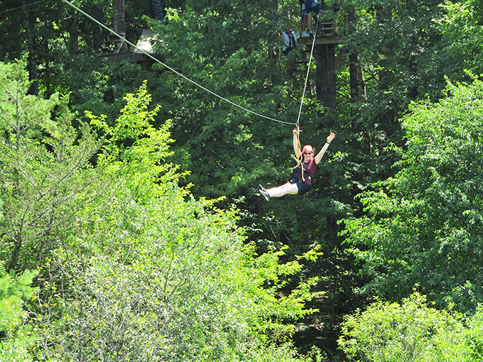 Freedom takes flight as adventurers zip through the trees, proving Maine's beauty is best appreciated at high speed. Photo credit: Take Flight Aerial Adventure Park
