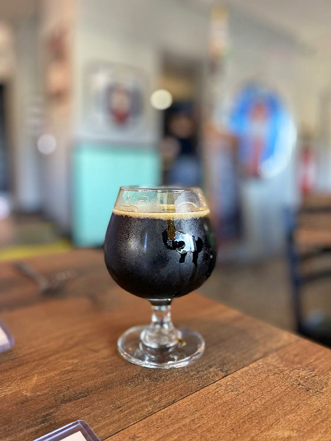 A frosty brew that's darker than my coffee on Monday morning. Perfect for washing down those epic burgers!