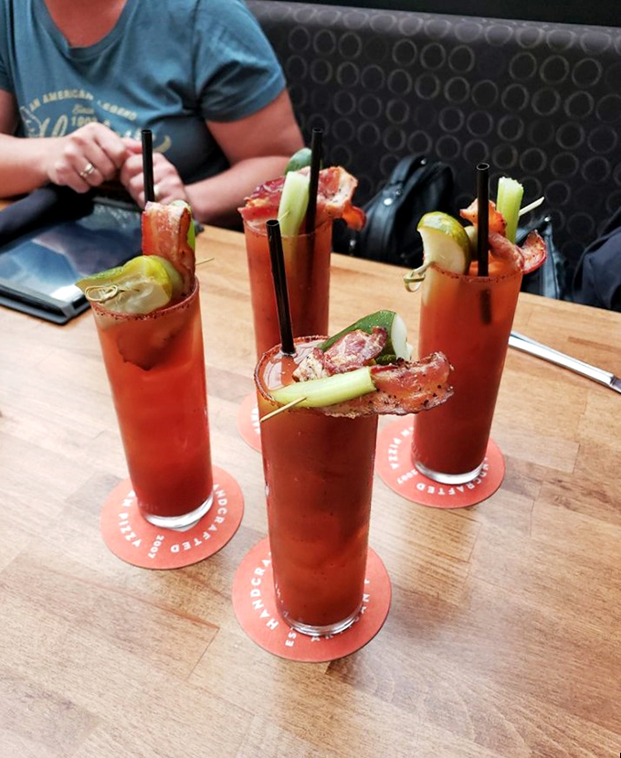 Bloody Marys that could double as appetizers! These zesty concoctions are like a liquid brunch, complete with enough garnishes to count as a serving of veggies.