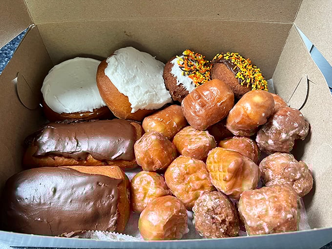 The breakfast of champions, delivered in cardboard. This box is like a treasure chest, but instead of gold, it's filled with fried dough.