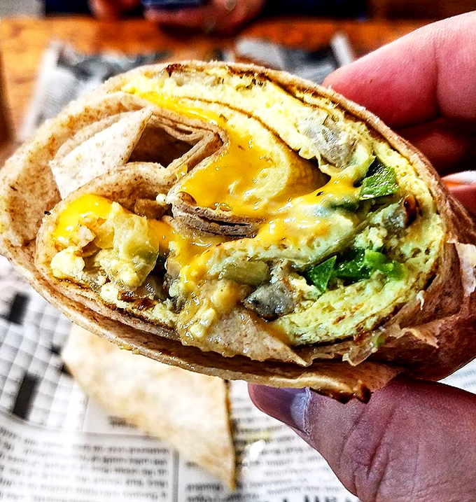 Burrito or work of art? This breakfast beauty is packed tighter than a college student's schedule, bursting with flavors that'll wake up your taste buds.