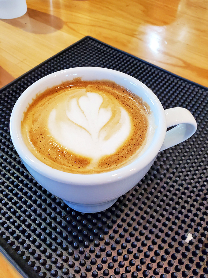 Latte art so pretty, you almost don't want to drink it. Almost. This cup of joe is like a warm hug for your insides.