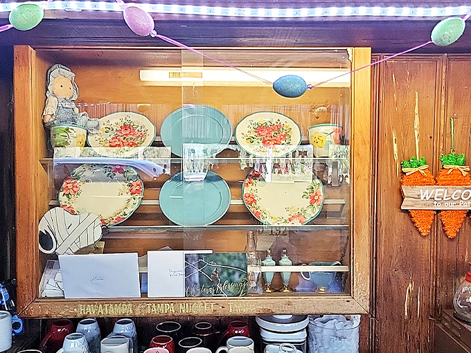 Grandma's china cabinet meets Mardi Gras! This whimsical display is serving up a heaping helping of Southern charm with a side of quirky.