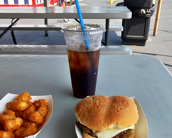 The holy trinity of diner dining: A burger that means business, fries that don't mess around, and a soda tall enough to quench a giant's thirst.