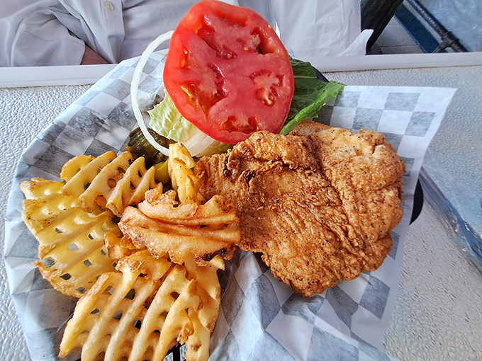 Crispy on the outside, tender on the inside &ndash; this fish is having an identity crisis in the best possible way. Paired with those waffle fries? Pure magic!