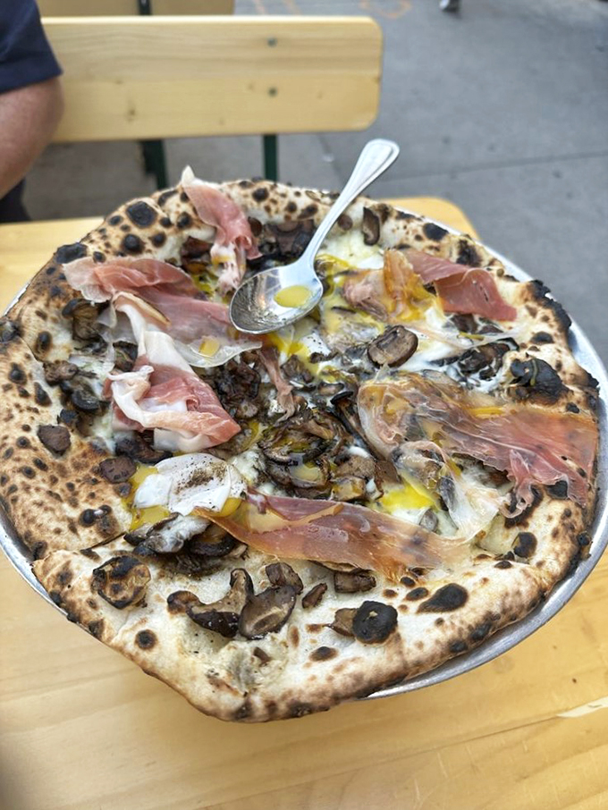 Fungi fanatics, rejoice! This mushroom pizza is a forest floor fantasy come to life. It's so earthy you might sprout roots at your table.