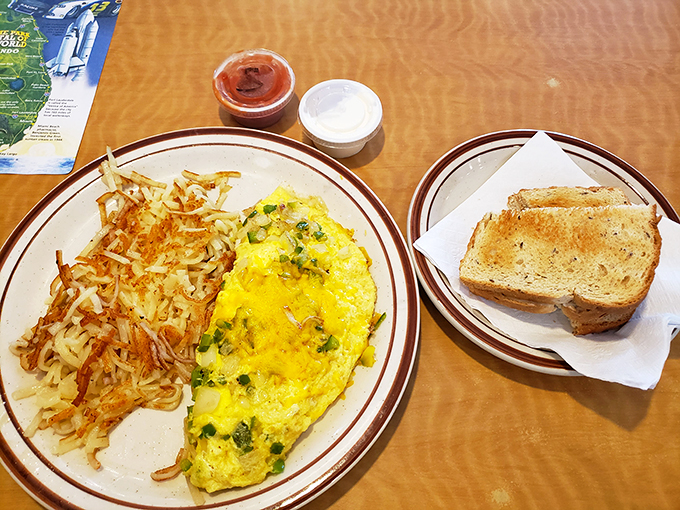 Eggs-cellence on a plate! This omelet is fluffier than a cloud and packed with more goodies than Santa's sleigh. Paired with crispy hash browns, it's breakfast nirvana. Photo credit: Happy Me