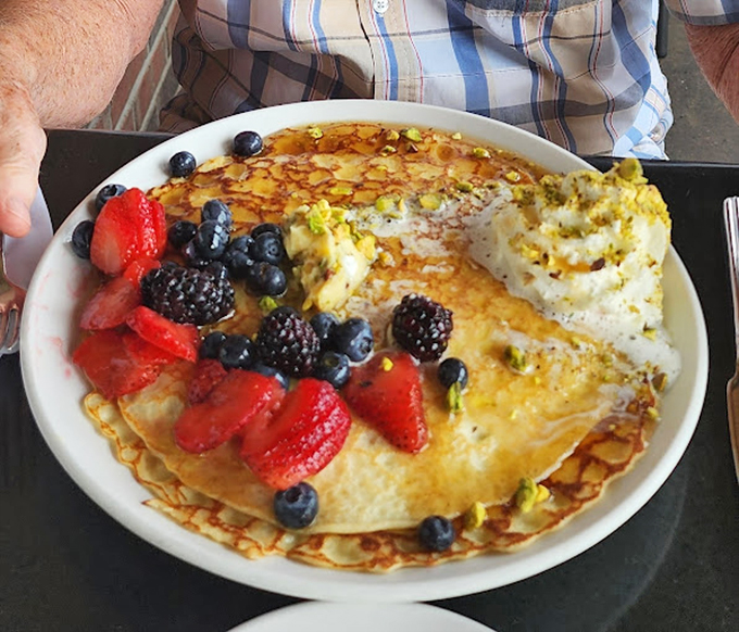 Pancake perfection! These fluffy discs of joy are ready to turn your morning blues into sweet, syrupy bliss. Fruit for health, pancakes for happiness!