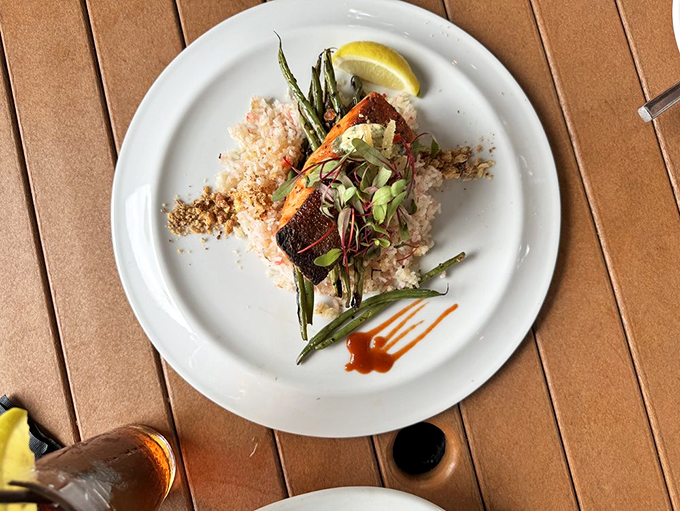 Swimming upstream to deliciousness! This salmon dish is a colorful symphony of flavors that would make Poseidon himself salivate. Photo credit: J H.