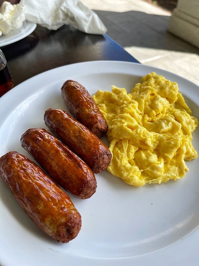 Sausages so plump, they could star in their own cooking show. Paired with eggs fluffier than a cloud on a lazy Sunday.