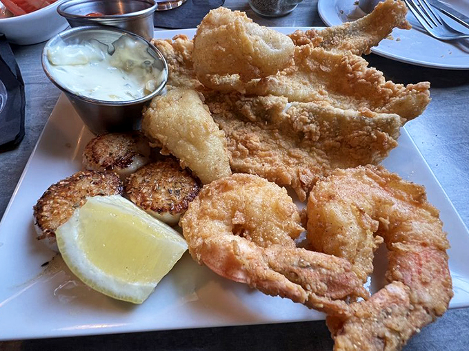 A seafood platter that brings the coast to Michigan - perfectly golden shrimp and fish alongside classic accompaniments.