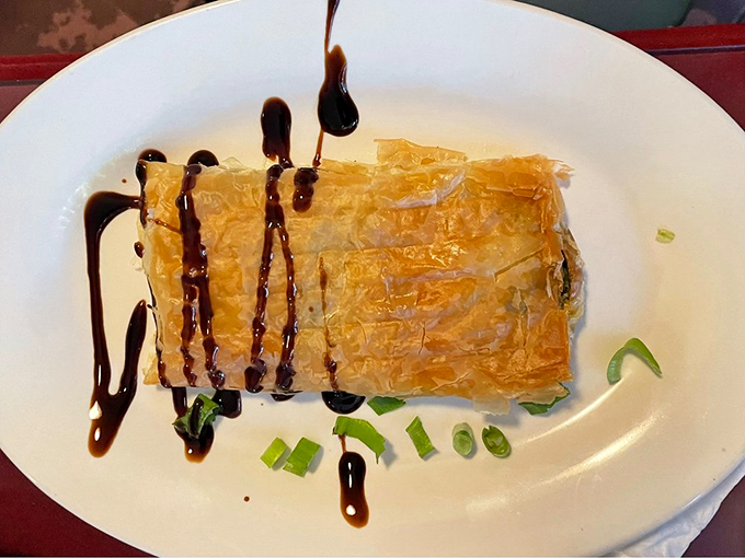 Flaky, savory, and oh-so-right. This spanakopita is proof that good things come in phyllo packages. Popeye would approve! Photo credit: Janis A
