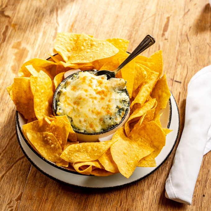 Spinach dip so good, it could make Popeye forget about his canned stuff. Creamy, cheesy, and dangerously addictive!