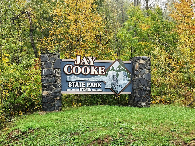Where the iconic swinging bridge meets fall's fiery hues, creating Instagram gold.