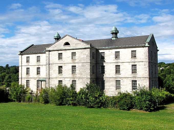 Greek Revival meets Granite State! The Kennebec Arsenal's sturdy facades have weathered centuries of change with stoic grace.