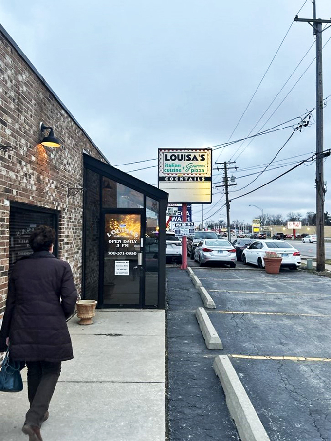 Louisa's: Where the parking lot might be simple, but the pizza is anything but. It's the Clark Kent of pizzerias.