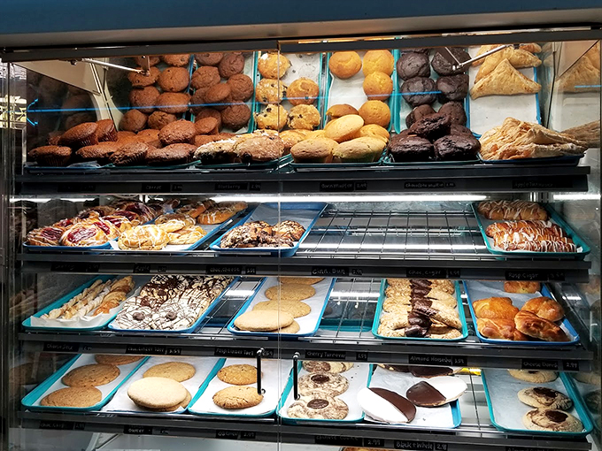 Sweet tooth paradise! This display case is like Willy Wonka's factory, but with less Oompa Loompas and more delicious treats.