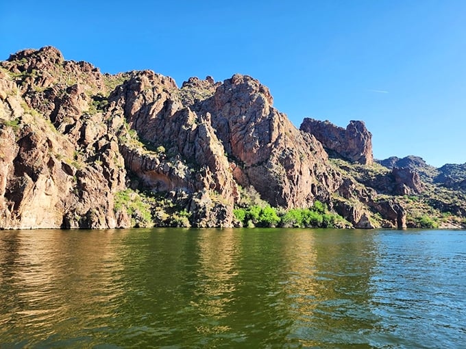 Mother Nature's masterpiece: where rugged cliffs meet placid waters, creating a scene that would make Bob Ross reach for his paintbrush.