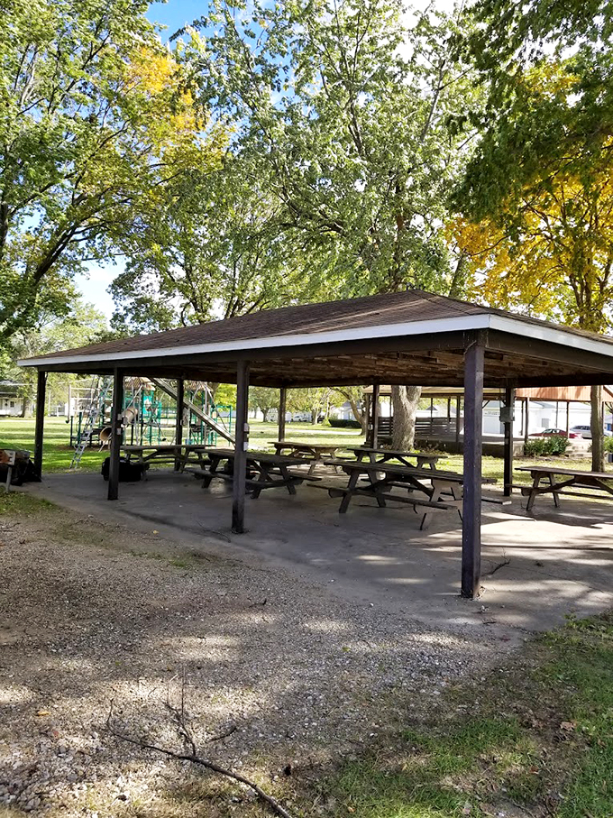 Under the shade of mature trees, this picnic shelter has witnessed countless family gatherings and community potlucks.