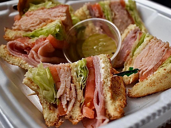 Layers of love! This club sandwich isn't just stacked&mdash;it's a towering testament to the timeless appeal of good ol' fashioned American fare. 