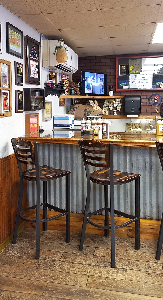 Wall of fame or BBQ hall of legends? This decor is serving up a side of nostalgia with every meal.