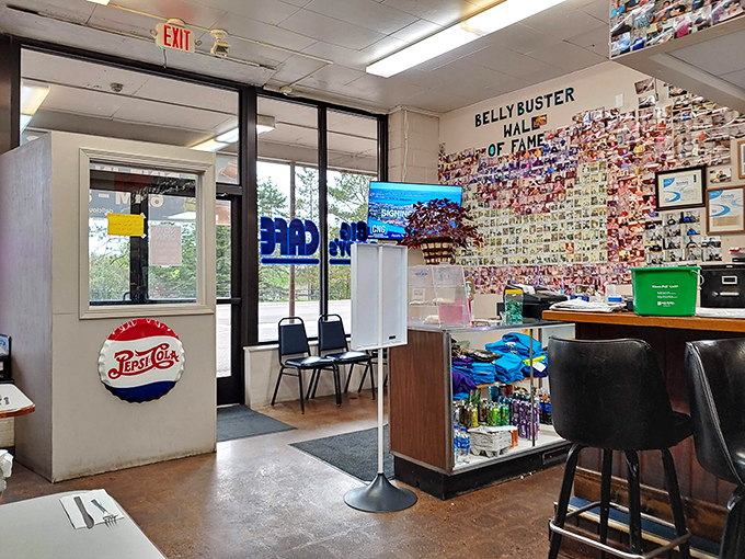 The "Belly Buster Wall of Fame" - where food challenges go to die and bragging rights are born.