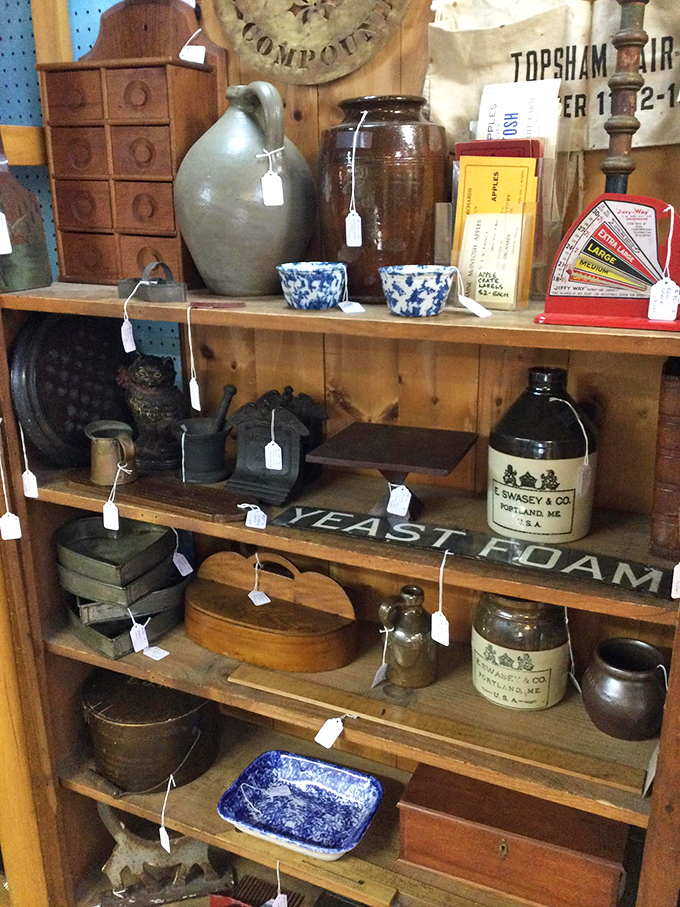 Vintage stoneware and pottery line these shelves like soldiers of time, each piece carrying its own unique history.
