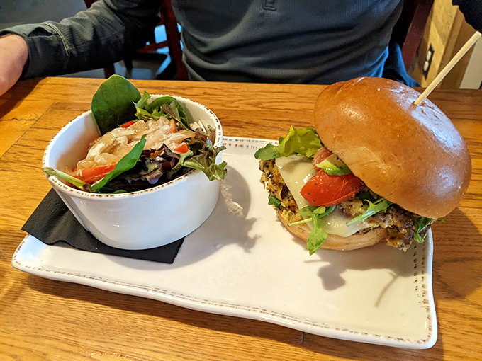 Fresh greens meet hearty burger in a plate that proves balance is beautiful - and delicious.